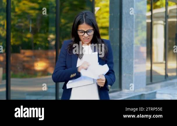 Angry furious female office worker throwing crumpled paper, having ...