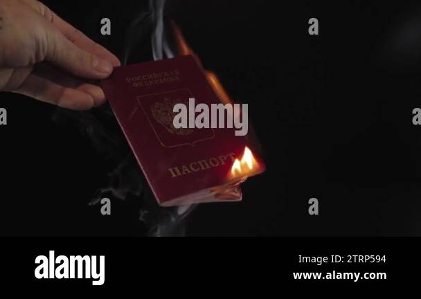 the lit passport of the Russian Federation. passport on fire. documents ...