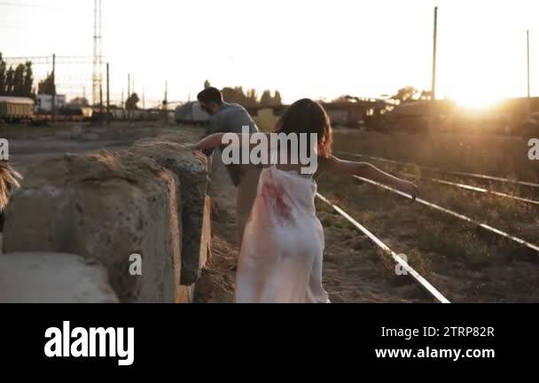 Picture of creepy male and female ghost or zombie walking with wounded ...