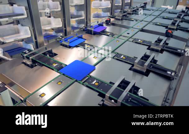 Footage of a working factory mechanism of solar cells distribution ...