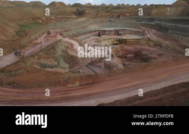 Excavators load ore into dump-trucks. This area has been mined for ...