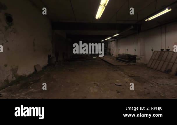 Smooth camera steady slide shot around old damaged industrial house ...