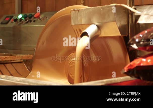liquid chocolate Stirring with pre-made bars of chocolate, tempering it ...