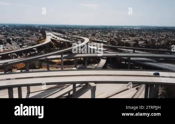 Drone flying right over multiple levels of epic highway junction ...