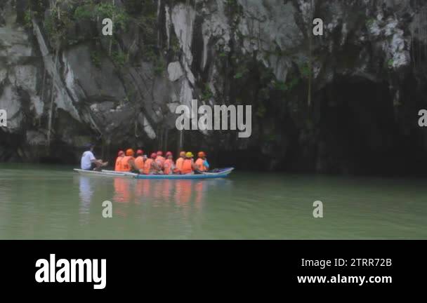 Palawan Cave Adventure. A group of tourists enter the Puerto Princesa ...