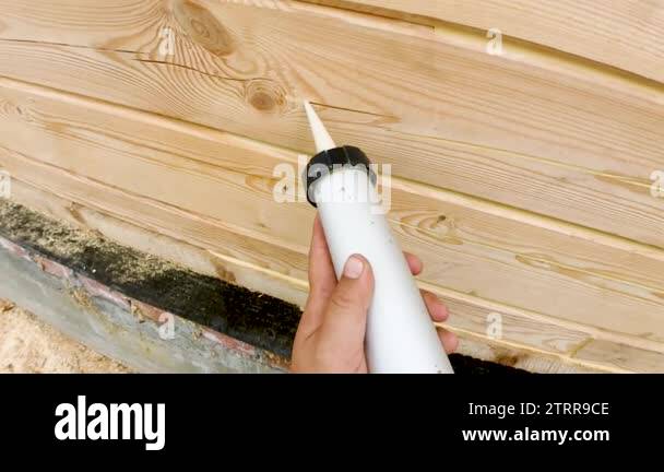 Sealing joints and cracks silicone sealant and insulation, insulation, painting a wooden house ...