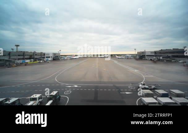 Vision of airports field with lorries on it through window Stock Video ...