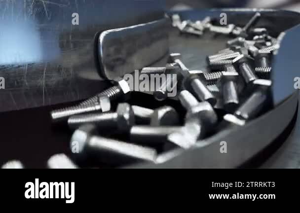 Process of production of bolts. Industrial concept. Factory equipment ...