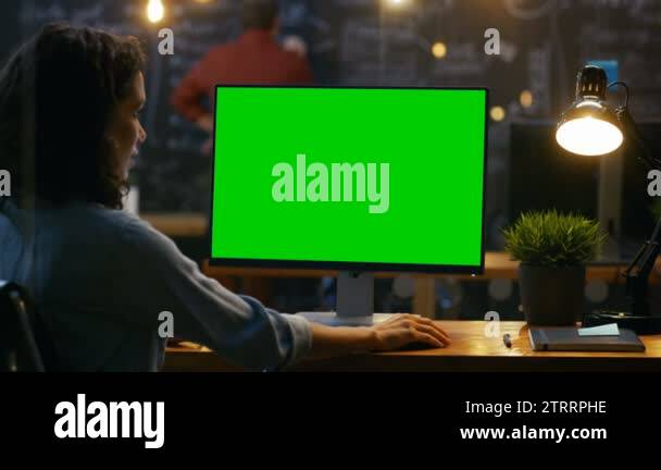 Beautiful Female Office Employee at Her Desktop Works on a Mock-up ...