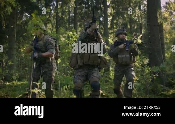 Three Fully Equipped Soldiers Wearing Camouflage Uniform Attacking ...