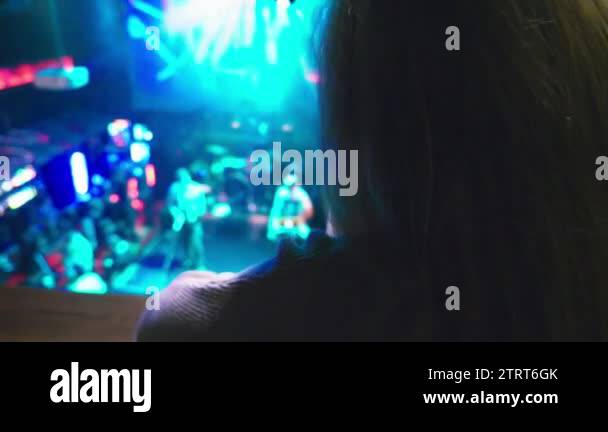 Blurred lighting in a nightclub for background. Low light toned image ...