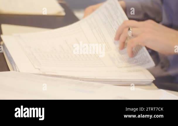 employee turning sheets with information in office Stock Video Footage ...