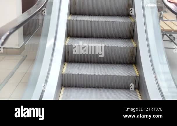Escalator stairs in mall - moving staircase running up Stock Video Footage - Alamy