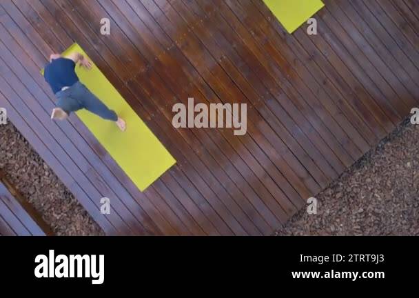 Drone footage of a group of people standing in the one-legged wheel ...