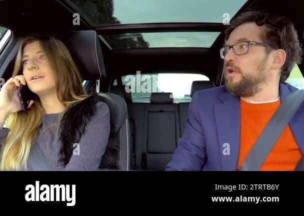 Father driving car getting angry with daughter talking on the phone ...