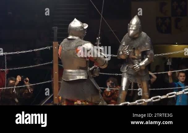 Two Medieval Knight Fighting In The Arena With Two-Handed Swords. Slow ...