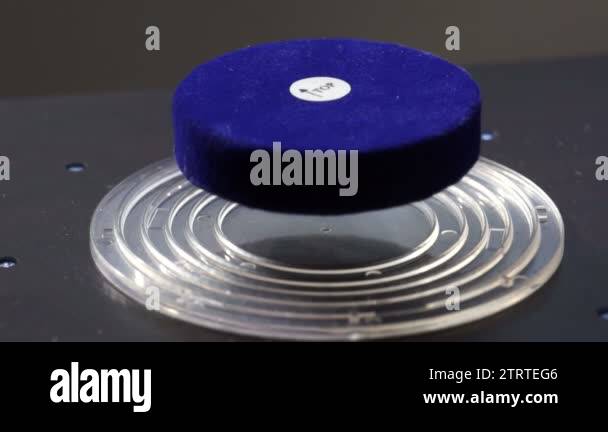 Magnet floating in a magnetic field Science Experiment Stock Video ...