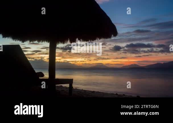 Beach Cabana Time-lapse. Day turns to night on a beautiful and isolated ...