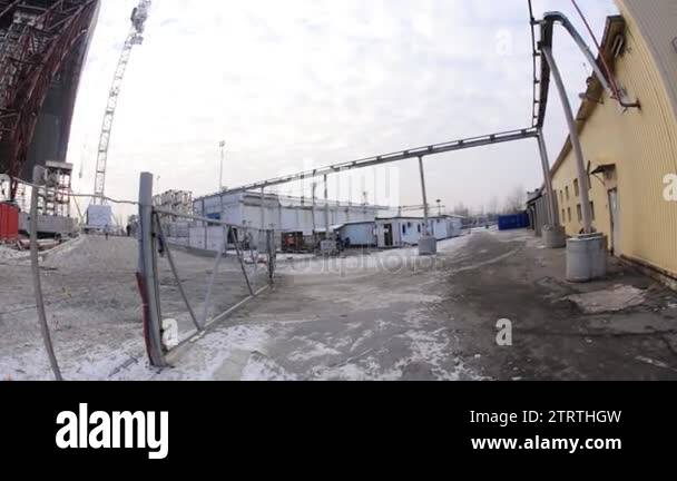 CHERNOBYL, UKRAINE - MAY 24, 2015: Workers assemble cage confinement ...