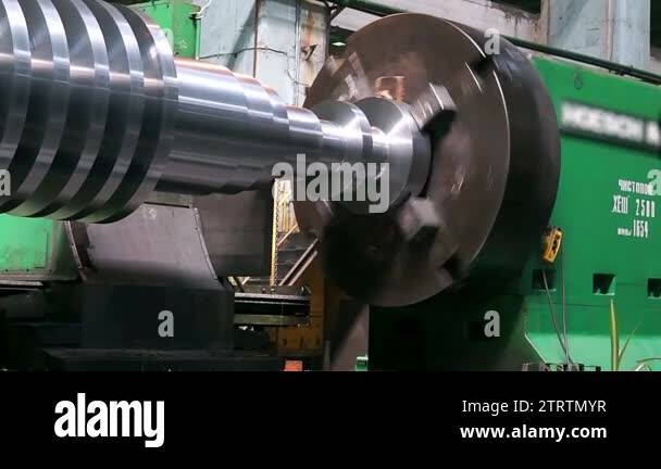 huge lathe closeup, large spindle lathe is rotating at an industrial ...