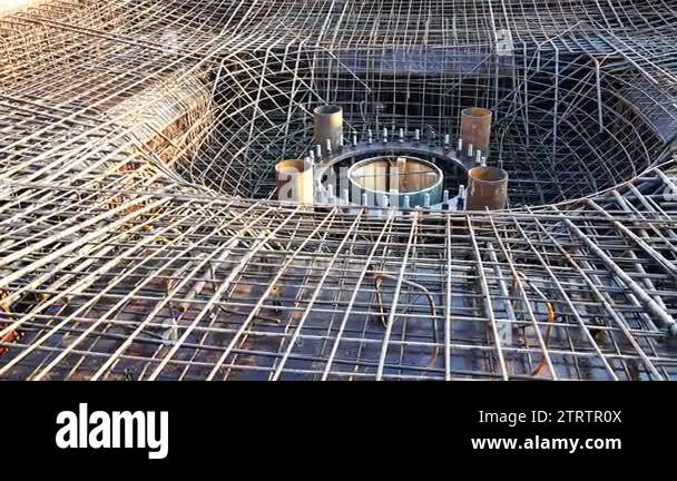 bars of reinforcing mesh for foundation with pipes and embedded bolts ...