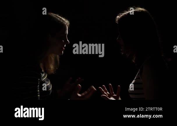 Two girls angry with each other. Anger, quarrel, violence. Unhappy mother and daughter or two ...