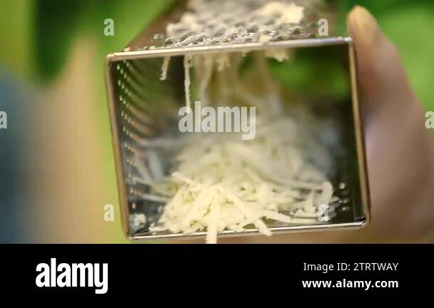 Cheddar cheese grating Stock Video Footage - Alamy