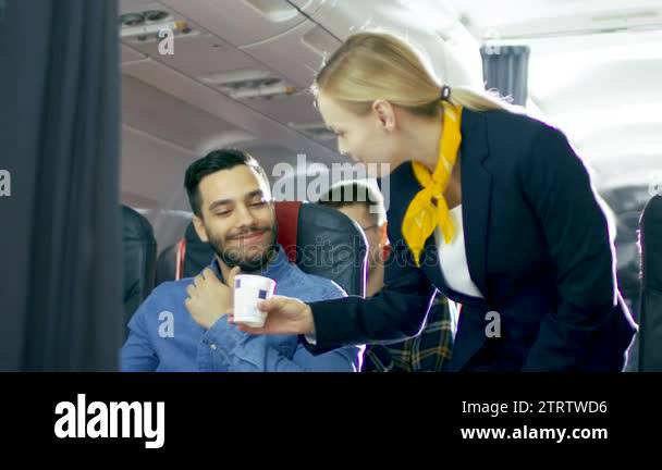Airplane Stewardess/ Flight Attendant Brings Coffee for Handsome ...
