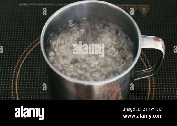 Boiling water on electric induction stove cooker Stock Videos & Footage ...
