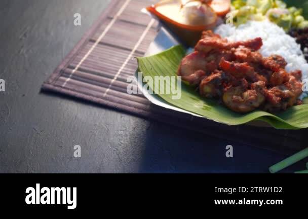 nasi kukus, traditional malay steamed rice with tumeric fried chickens ...