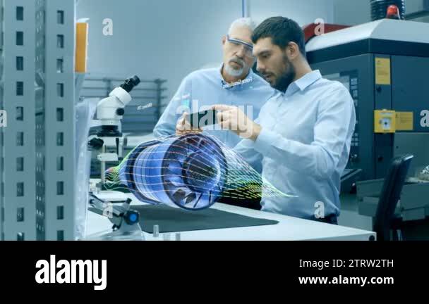 Two Engineers Works with Mobile Phone Using Augmented Reality ...