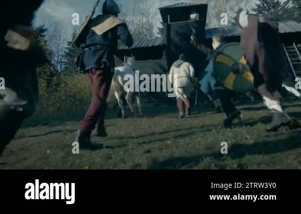 Medieval Battle Reenactment. Violent Tribe of Warriors Attacks Wooden ...