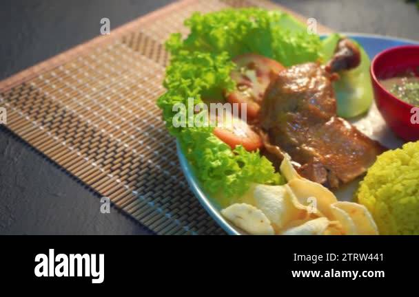 nasi kukus, traditional malay steamed rice with tumeric fried chickens ...