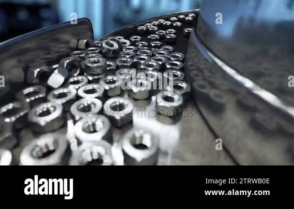 Process of production of nuts, screws. Industrial concept. Factory ...