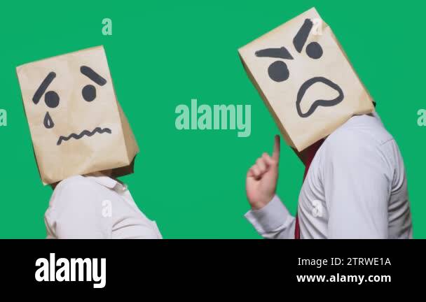 The concept of emotions and gestures. Two people in paper bags with ...