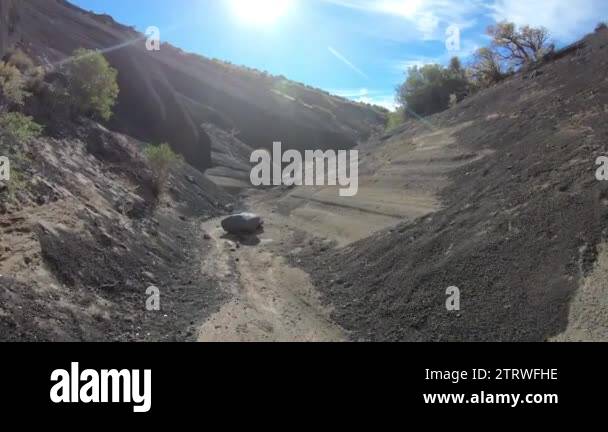 Walking inside volcano malacara grey debris, dry river of vocanic ...