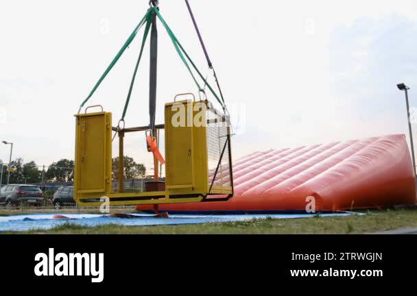 Bungee jumping platform hanging above safety mat, dangerous activity ...