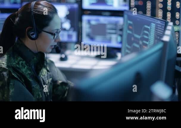 Female Military Technical Support Professional Gives Instructions into ...