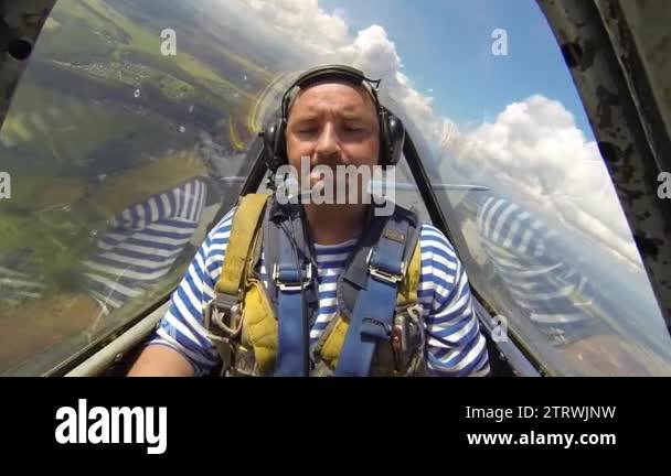 Man in the cockpit of an airplane carrying an aerobatics figure Stock ...