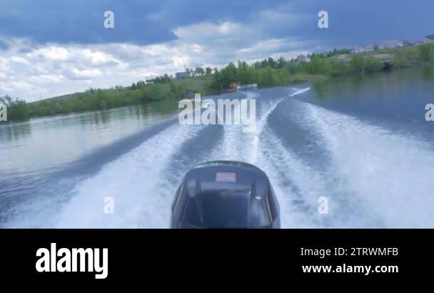 Trail on water surface behind of fast moving motor boat. the motor of ...