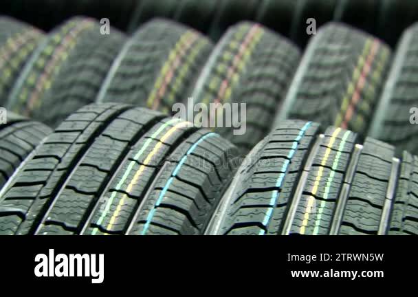 New stacked tires at the tire production plant panoramic and tilt video footage Stock Video ...