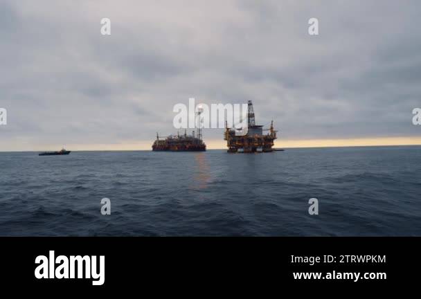FPSO tanker vessel near Oil Rig platform. Offshore oil and gas industry ...