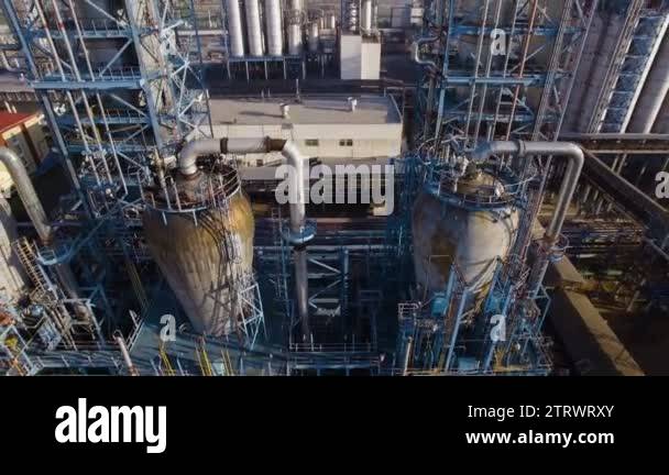 Two huge towers distillation pipes and tanks at the refinery. Aerial ...