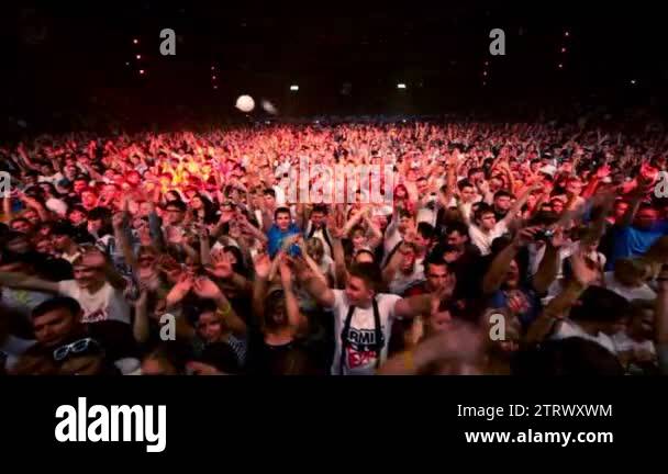 People stand hands up at rave party in large hall Stock Video Footage ...