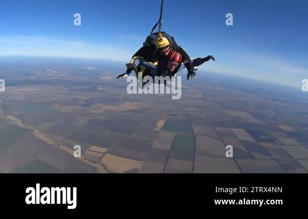Tandem Skydiving. The moment of opening the parachute. Tandem Jump ...