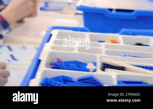 School boy hands at engineering classroom making robot. Robotechnics education Stock Video ...