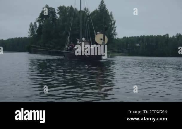 Viking Warriors on a Row Ship Arrive to Shore. Slavs and Vikings ...