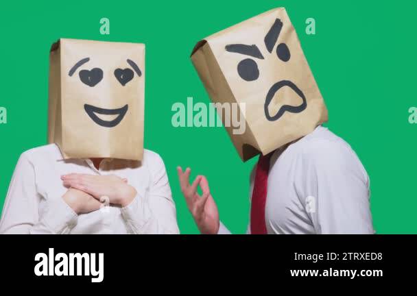 The concept of emotions and gestures. Two people in paper bags with a ...