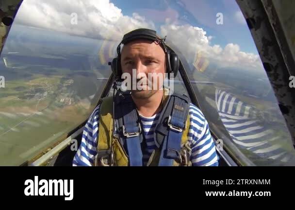 Man in the cockpit of an airplane carrying an aerobatics figure Stock ...
