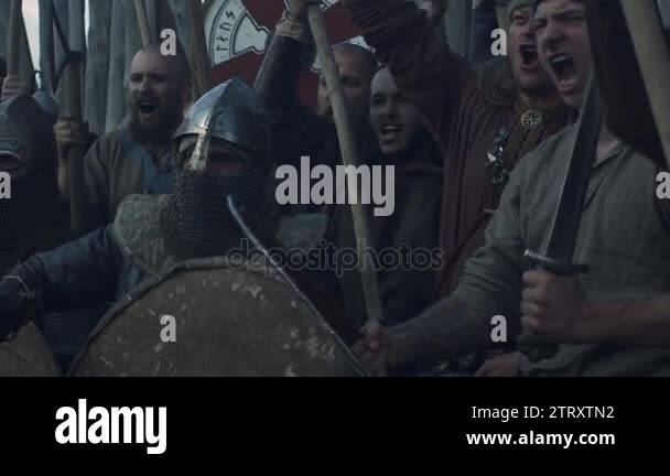 Army of Vikings Screaming before the Battle during Slavs and Vikings Festival. Medieval ...